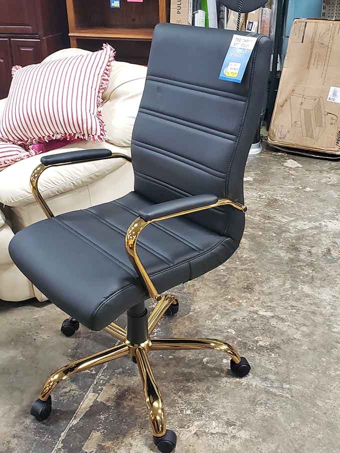 A gold-accented office chair that screams "executive" without the executive price tag attached to it.