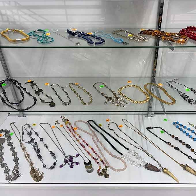 Jewelry sparkling behind glass like tiny treasures waiting to add some shine to someone's everyday wardrobe.