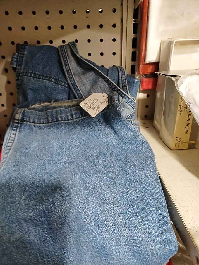 Denim overalls hang with that "Hand Crafted" tag, ready for someone's farm chores or hipster coffee shop shift equally well.