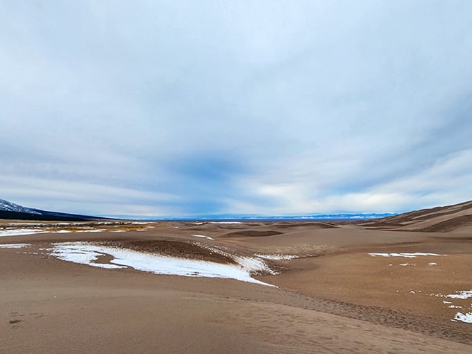 Snow-dusted peaks meet golden sand in a geographical mashup that shouldn't work but absolutely does spectacularly well.