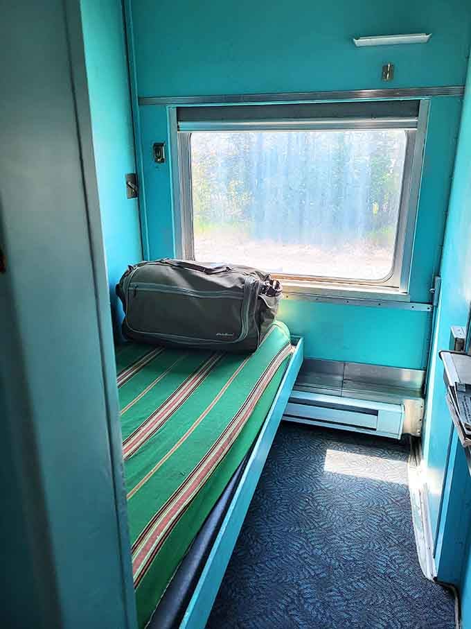 A cozy sleeping berth where passengers once dozed while crossing the continent, rocking gently to the rails' rhythm.