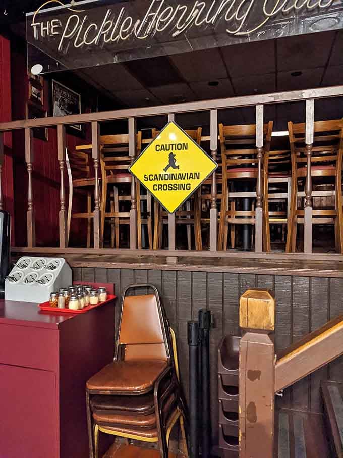 Elevated seating with a "Scandinavian Crossing" sign, because even the chairs have a sense of humor.