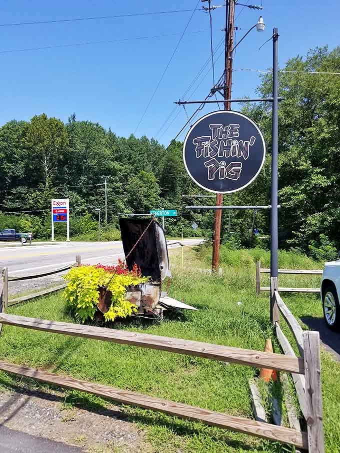 The roadside sign stands proud among the greenery, beckoning travelers to stop and discover what all the fuss is about.