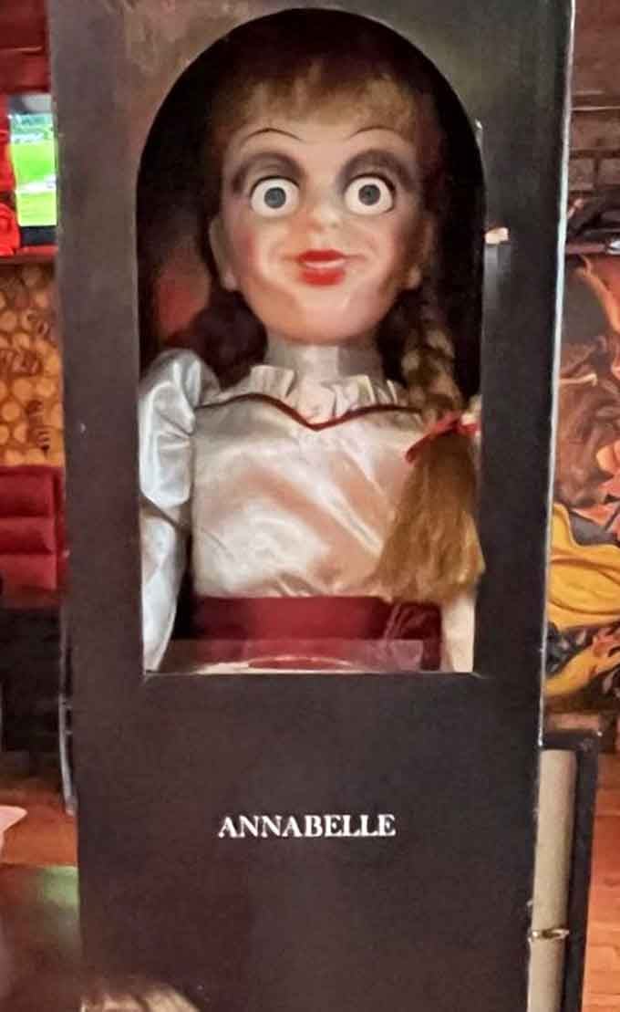 The Annabelle doll sits behind glass, which is probably for everyone's safety and peace of mind here.