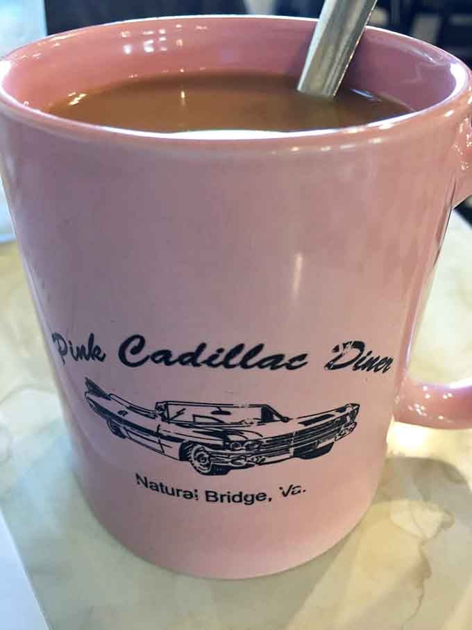 Coffee served in a pink mug branded with the diner's name, making every sip feel like part of something special.