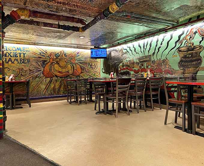 Colorful murals featuring everything from economics diagrams to whimsical creatures cover every available wall surface throughout the restaurant.
