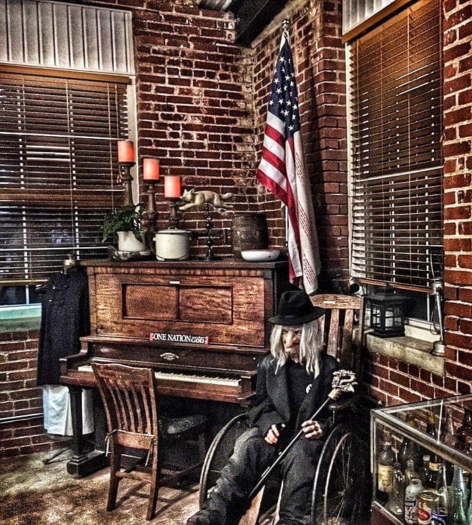 This vintage piano sits ready to play, though visitors report hearing phantom melodies when nobody's touching the keys.