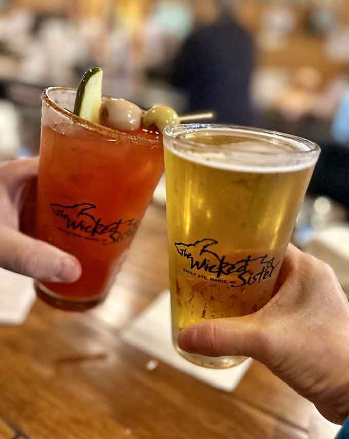 Cheers to good times: a Bloody Mary and a cold beer, the perfect liquid companions for burger adventures.