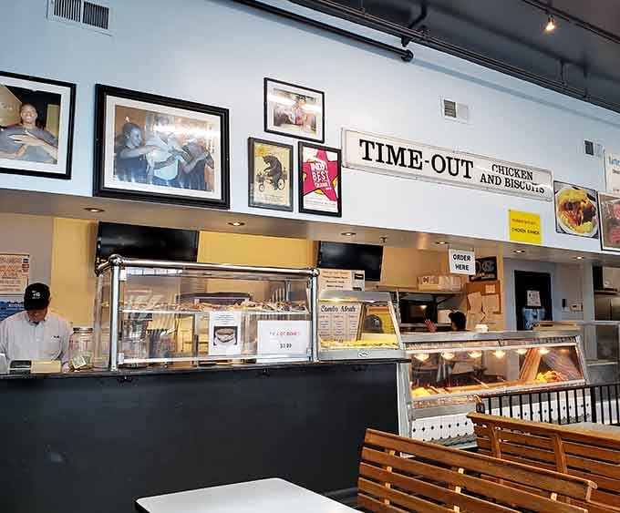 The counter where magic happens 24/7, complete with biscuits waiting patiently in their display case for their moment of glory.