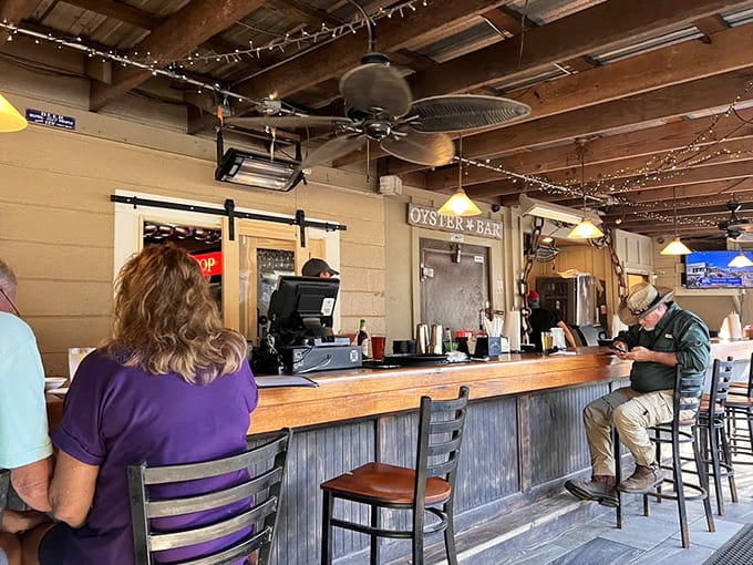 The oyster bar beckons with promises of freshly shucked bivalves and cold beverages to wash them down.
