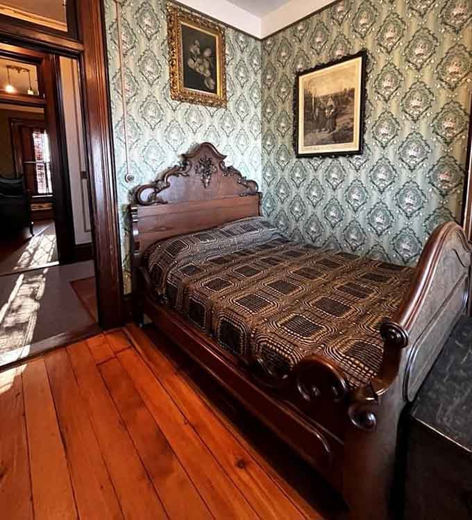 Sleep like Victorian royalty in a bedroom where even the wallpaper refuses to be ordinary.