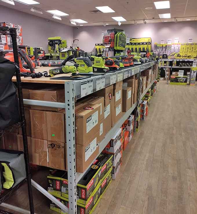 Power tools lined up like a hardware store rainbow, ready to tackle projects you'll definitely start someday.