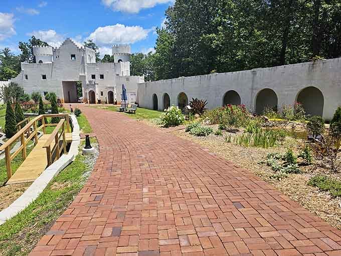 Brick pathways wind through gardens where castle walls frame mountain views like nature's own postcard collection.