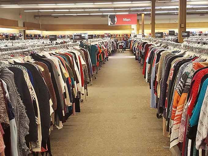 The men's clothing section goes on forever, organized by color like a well-planned closet you wish you had.