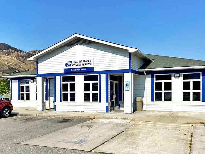 The post office &ndash; where mail still matters and the blue trim reminds you that some government buildings can actually be charming rather than intimidating.