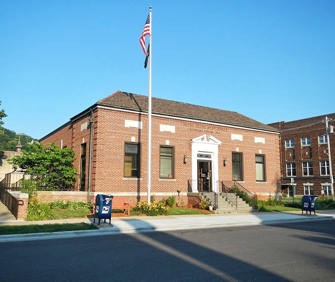 The post office&mdash;where small-town news travels faster than the mail itself. This brick sentinel has witnessed countless letters of love, loss, and everyday life.