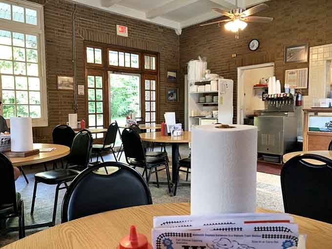 Original depot windows frame a dining room where the past and present share a table quite comfortably.