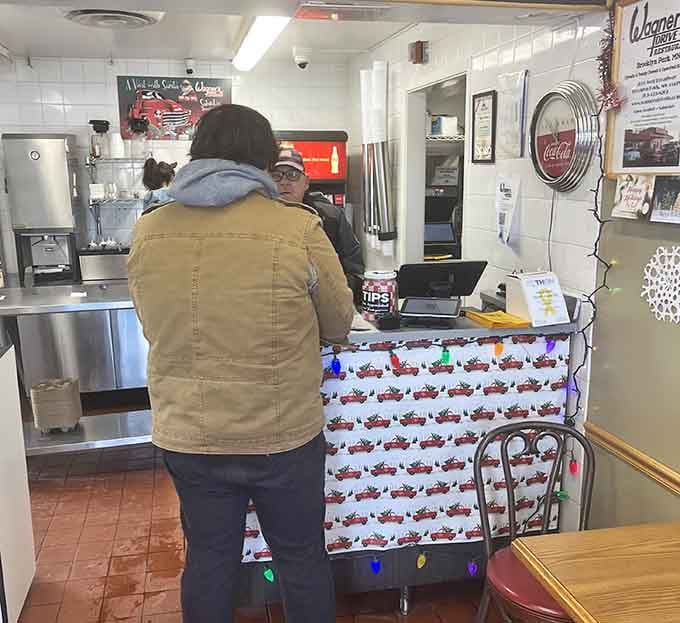 The command center where magic happens, complete with festive lights and that classic diner charm we've been missing.