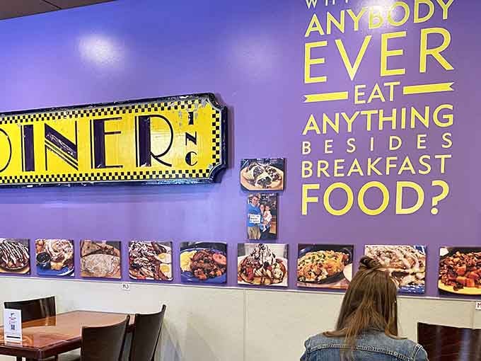 The wall decor celebrates breakfast with the enthusiasm it deserves, featuring a diner sign that could guide ships to shore.