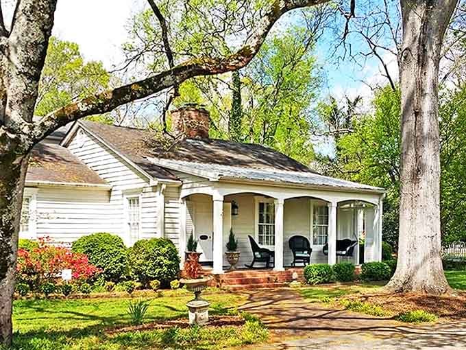 This charming cottage with its perfect porch practically begs you to sit a spell, preferably with something cold and sweet in a mason jar.