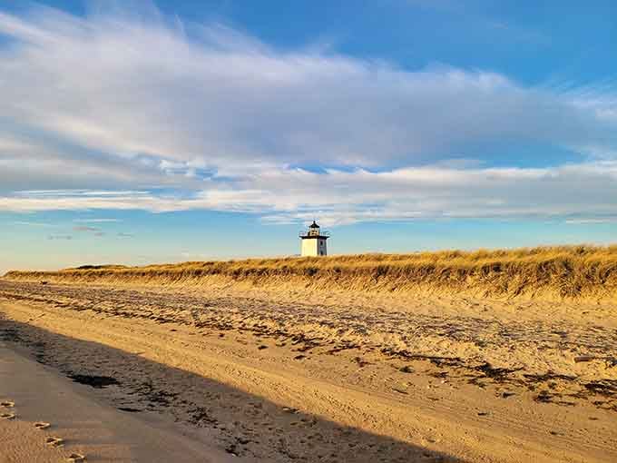 The view reveals just how isolated this lighthouse really is, surrounded by sand and sky.