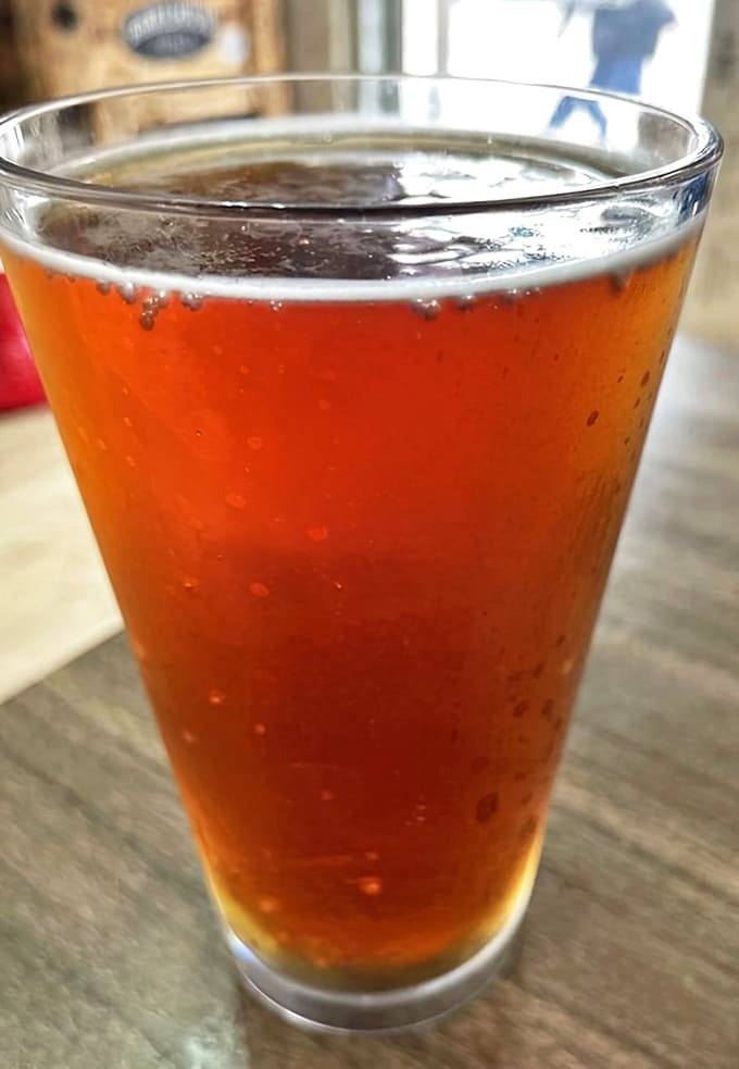 A perfectly poured amber brew, with bubbles that dance in Tennessee sunlight. In barbecue country, this isn't just a beverage &ndash; it's a palate-cleansing necessity.