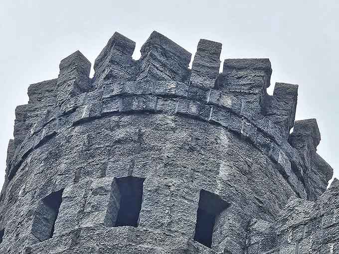 Stone upon stone, the tower reaches skyward with rough-hewn determination, its crenellated top silhouetted against Florida's impossibly blue sky.