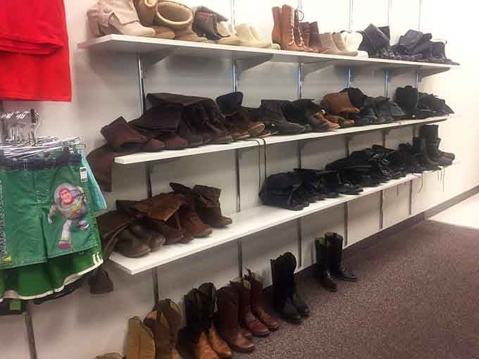 Boots standing at attention like they're ready to march into someone's closet and start a whole new adventure on different feet.