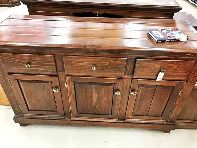 This solid wood cabinet whispers tales of dinner parties past while promising to hold your treasures for generations to come.