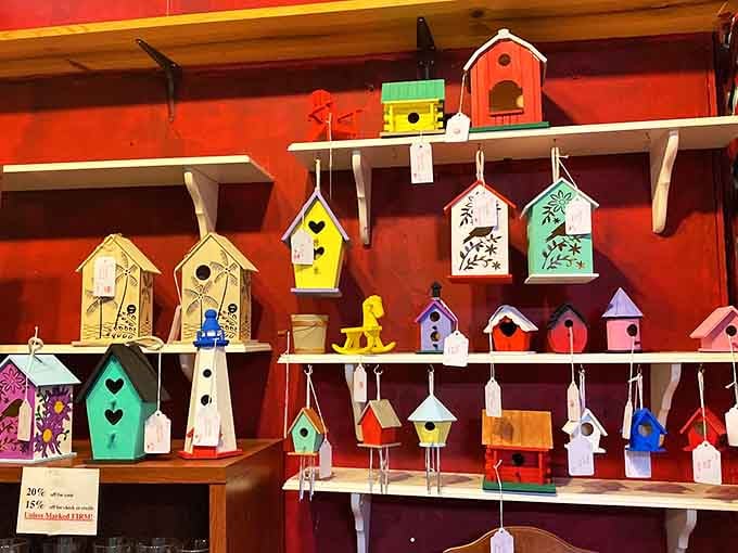 Handcrafted birdhouses in cheerful colors prove that even the birds deserve charming vintage-inspired real estate.