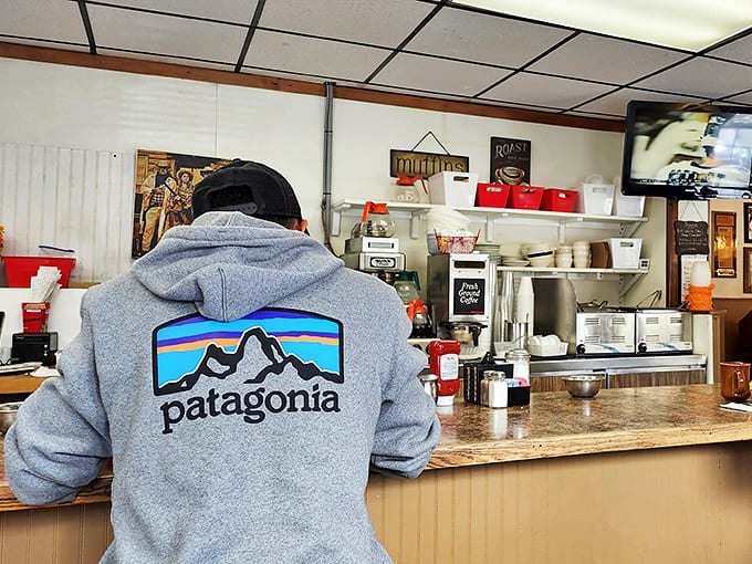 Counter culture at its finest &ndash; where regulars perch to watch breakfast magic unfold and coffee cups never reach empty. The Patagonia jacket suggests even outdoor enthusiasts know where to fuel up.