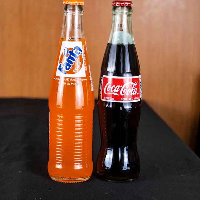 The classic pairing&mdash;Mexican Fanta and Coca-Cola in glass bottles, because some traditions transcend borders and complement fried fish perfectly.