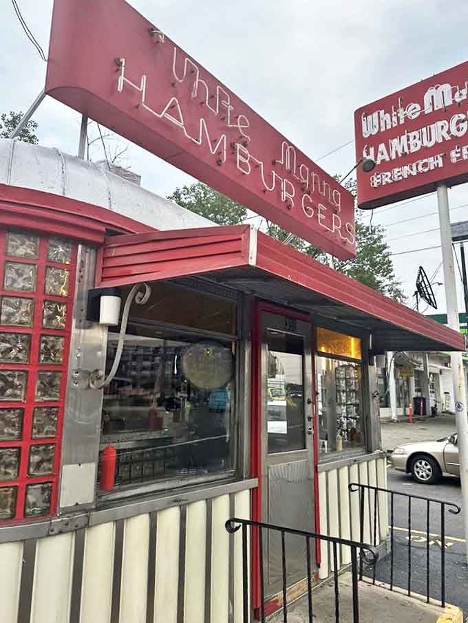 The entrance feels like stepping into a Norman Rockwell painting where everyone's happier because there are burgers inside.