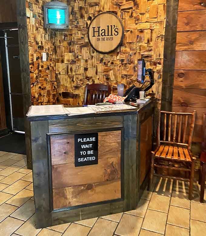 That rustic wood accent wall and vintage lantern give off serious cabin-by-the-water vibes worth savoring.