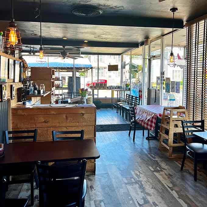Sunlight streams through windows illuminating simple wooden tables. This isn't dining&mdash;it's communing with the BBQ gods in their natural habitat.