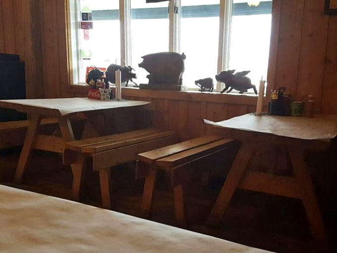 Another angle of barbecue paradise – where wooden benches and tables create a communal dining experience that feels like Sunday dinner at your favorite relative's house.