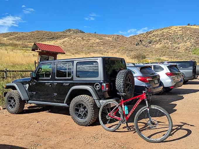 The trailhead parking lot—where adventures begin and comfortable shoes become your most valuable possession.