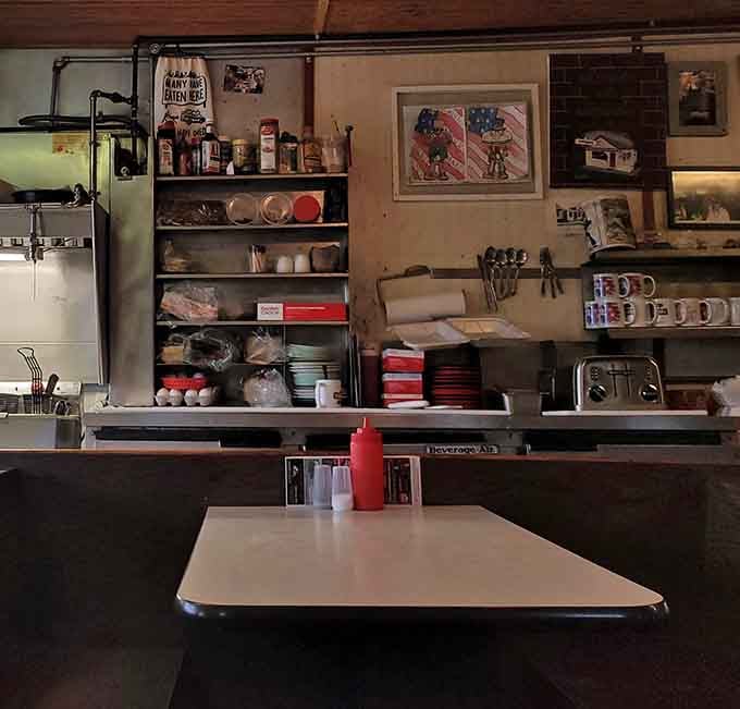 Wooden booths polished by generations of elbows and conversations – the kind of authentic patina money can't buy.