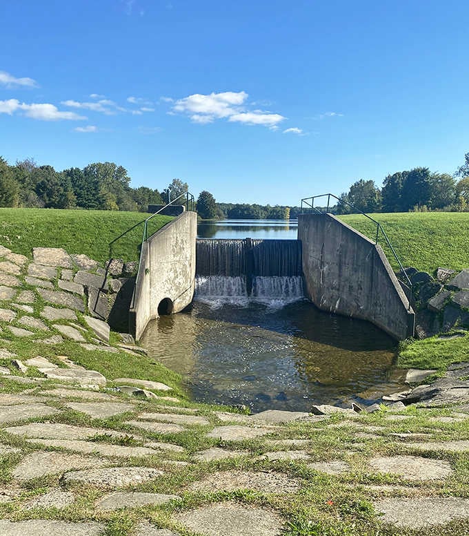 Engineering meets nature at this charming spillway. Water always finds its way, just like visitors always find their way back here.