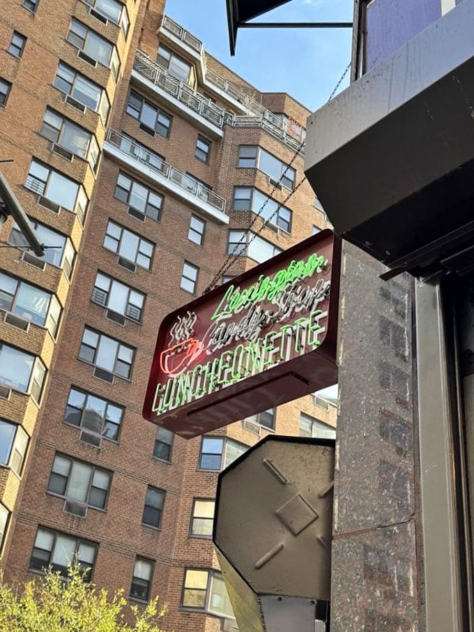 The neon sign glows against Manhattan apartment buildings like a beacon from another era&mdash;no Instagram filter required.
