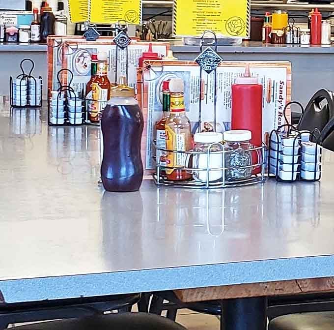 Every proper diner table comes equipped with this essential toolkit for customizing your meal&mdash;hot sauce is non-negotiable.