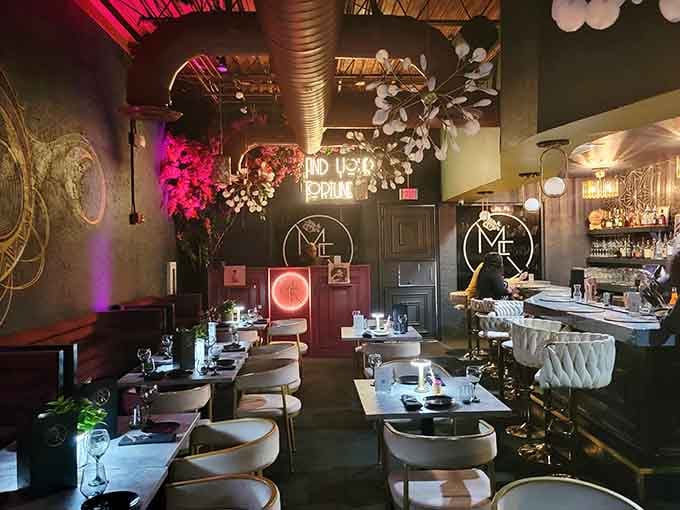 Velvet seating and moody lighting create an atmosphere that's equal parts mysterious fortune teller and glamorous supper club.