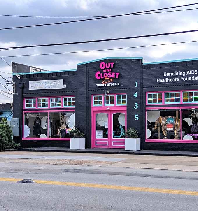 The hot pink trim and numbered doors create an inviting atmosphere where shopping supports vital healthcare services.
