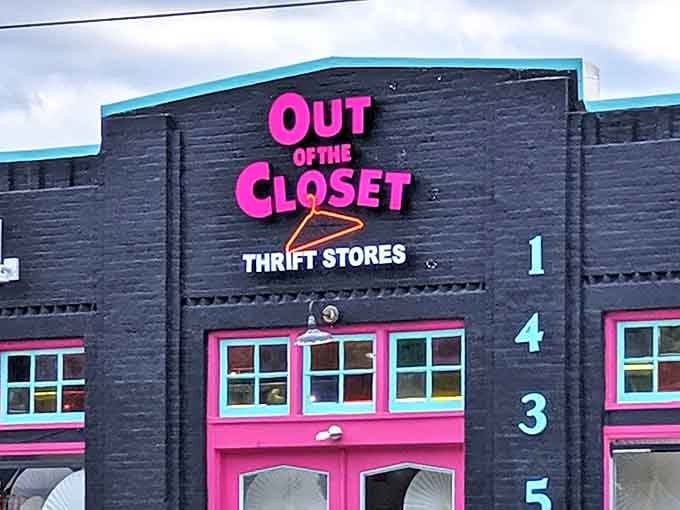 Out of the Closet's bold pink signage and numbered windows create a playful atmosphere that makes secondhand shopping feel celebratory.