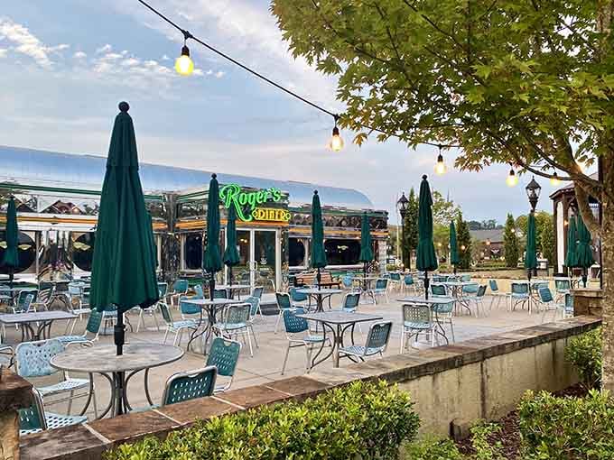 That gleaming chrome diner catches the evening light like a silver bullet filled with pancakes, burgers, and pure nostalgia.