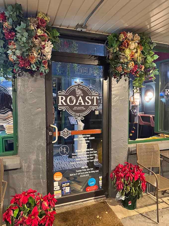 Lush floral wreaths frame this entrance like something from a Victorian garden party hosted by a very stylish mystic.