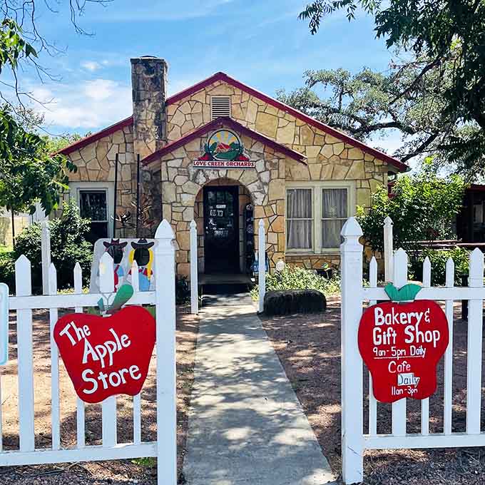 Love Creek Orchards' stone cottage and white picket fence create a storybook setting for apple pies and sweet memories.