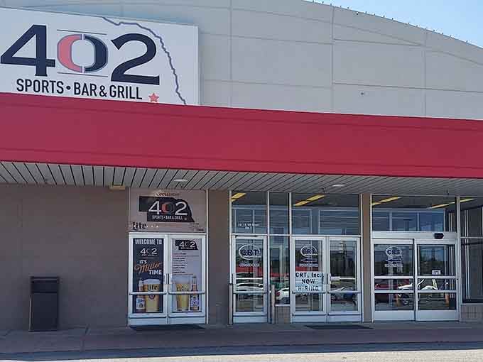 The 402 Sports Bar & Grill welcomes Husker fans and hungry locals alike—where the TVs are always tuned to the game and the beer is always cold.