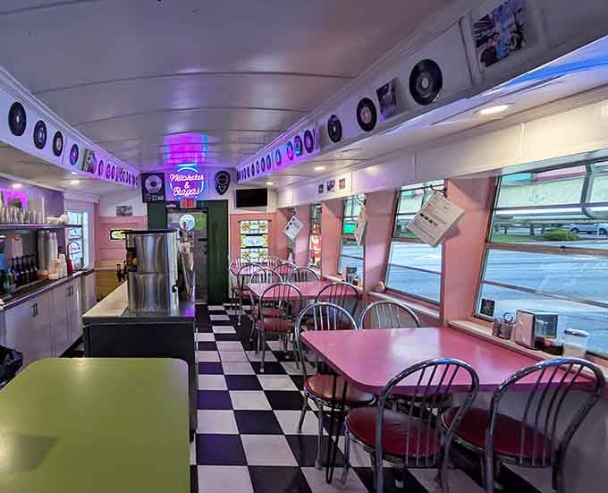 Pink booths, neon signs, and checkered floors combine to create an atmosphere that Instagram wishes it could replicate.
