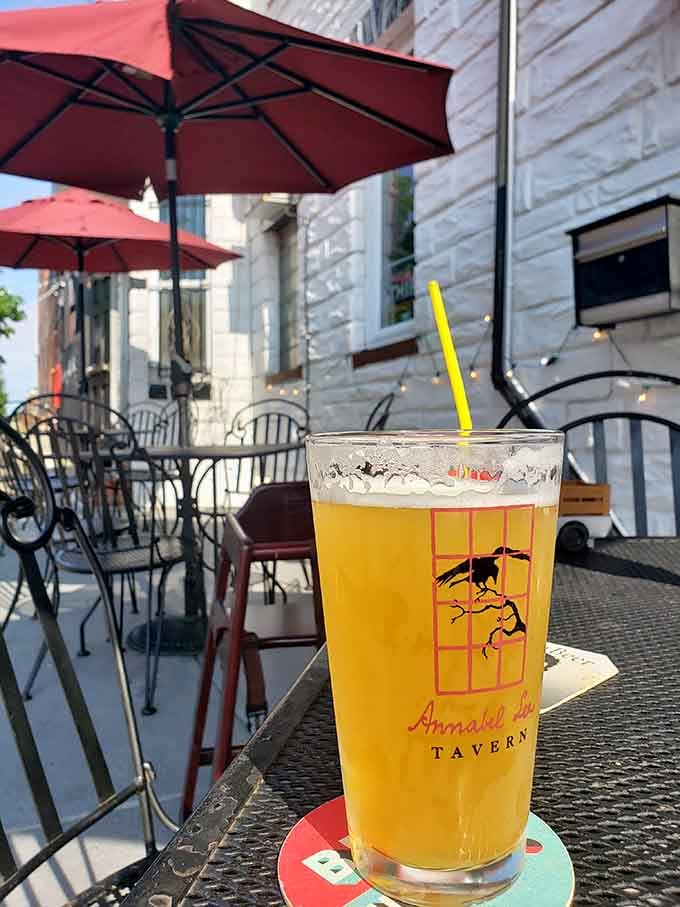 Cold beer in branded glassware on the patio, where you can contemplate ravens without the existential dread.